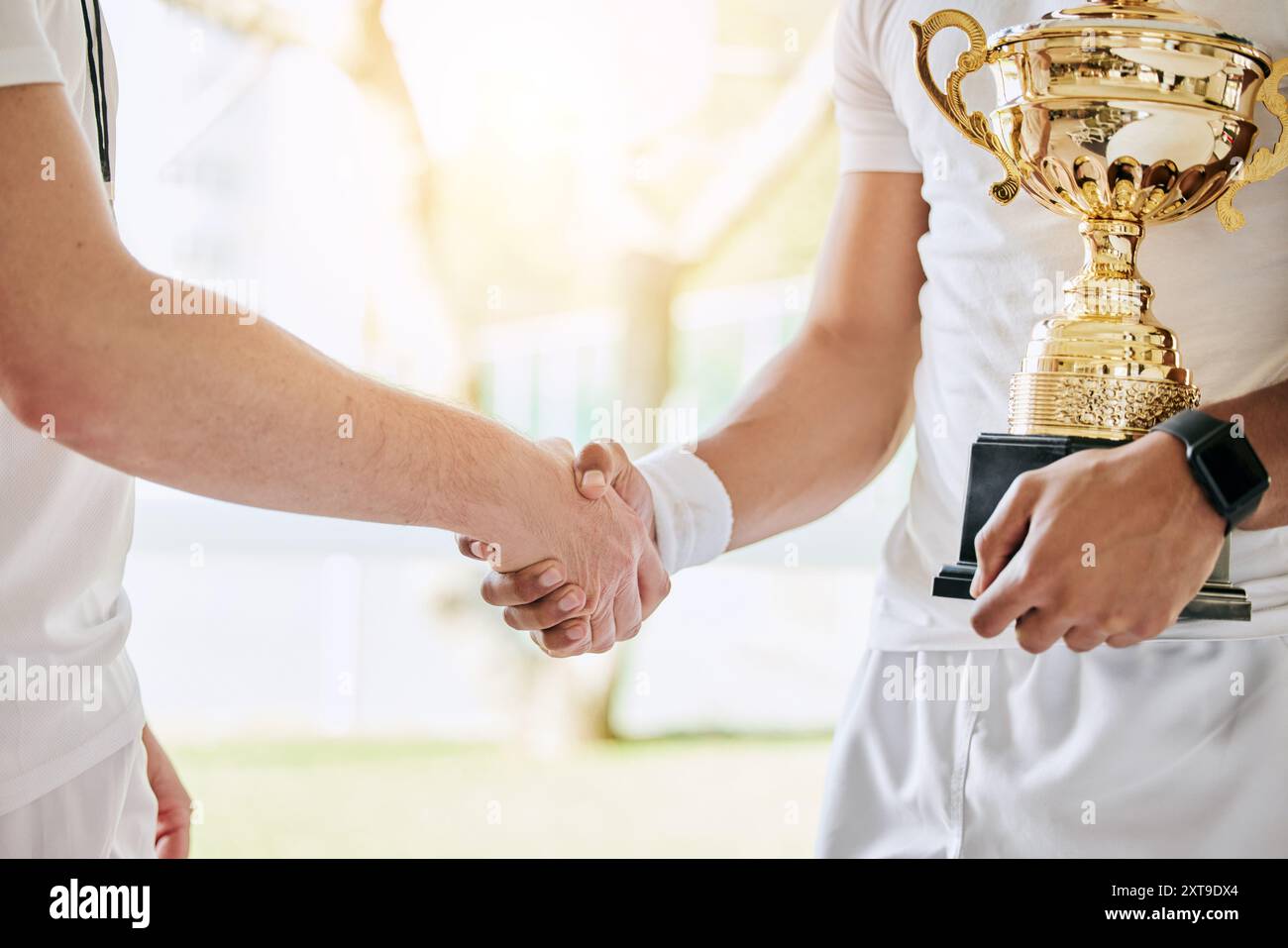 Handshake, sport and people with trophy for winning, success and ...