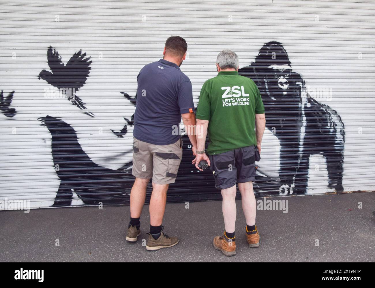 London, UK. 13th August 2024. Zoo staff inspect the new artwork by ...