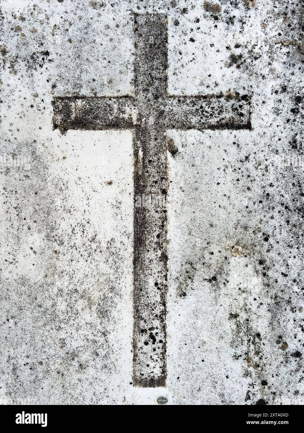 Image on light-toned stone of a vertical cross, with a lot of texture ...