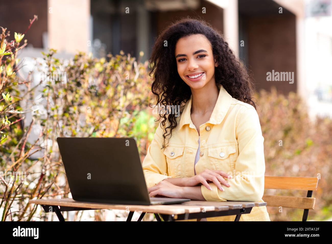 Portrait of attractive wavy hair girl enjoying good work laptop ...