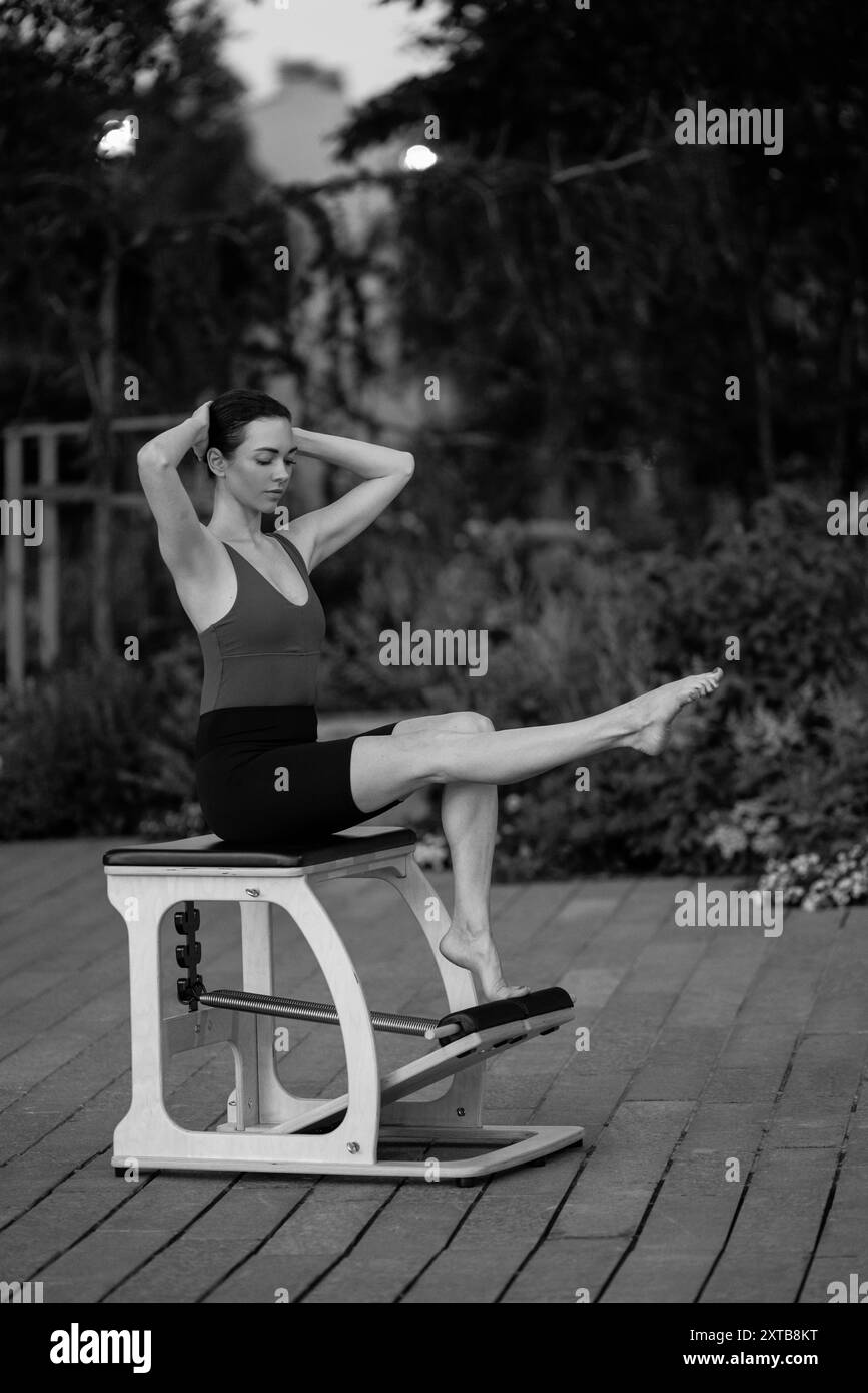 Pilates reformer chair woman fitness yoga gym exercise. Correction of ...