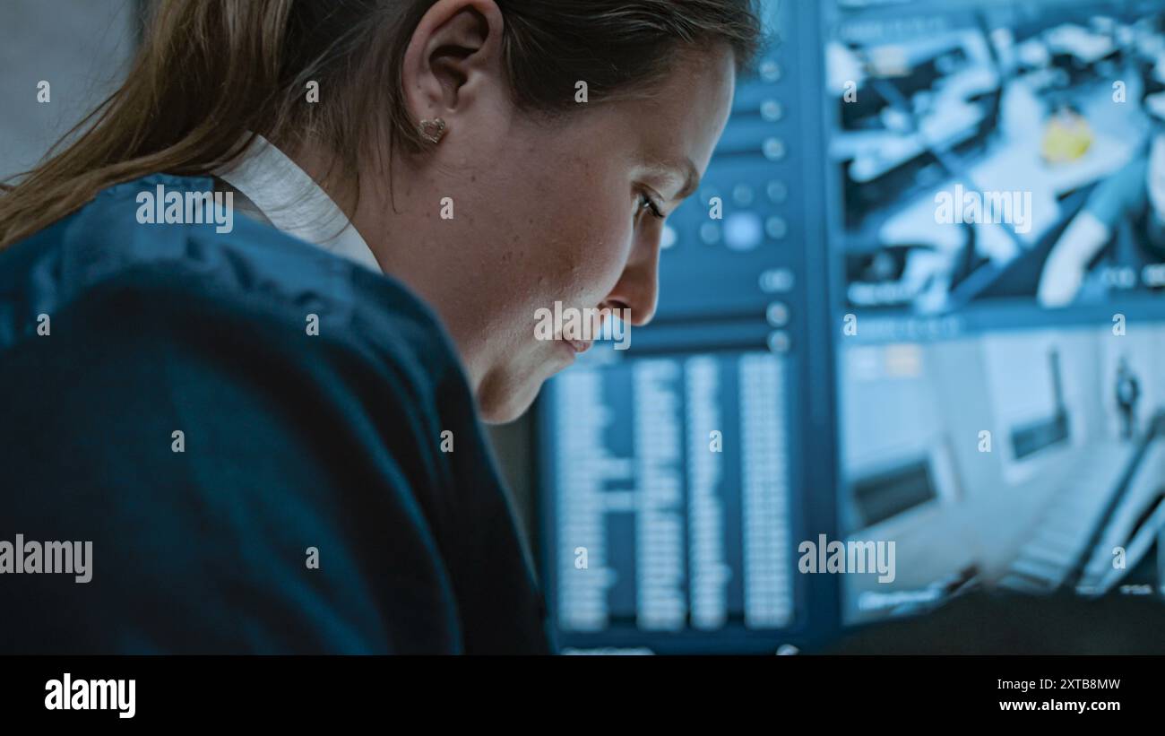 Multiethnic surveillance operators control security cameras on screens ...