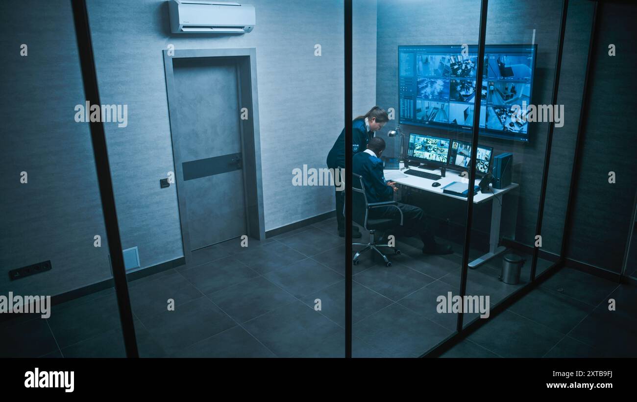 African American Cctv Operator Works On Computer Watching Security Cameras In Office