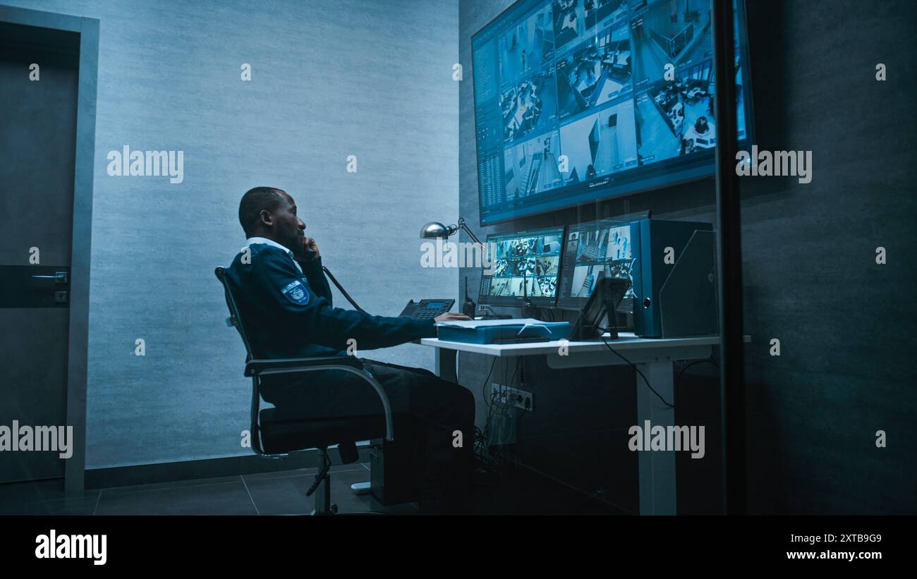 African american employee using cctv hi-res stock photography and ...