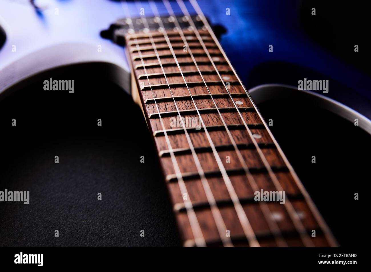 Fretboard of modern electric guitar. Close up Stock Photo - Alamy