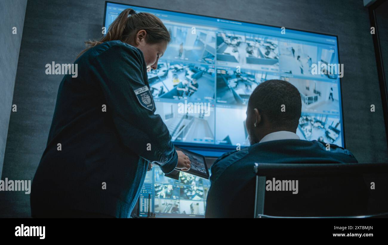 Police office using tablet hi-res stock photography and images - Alamy