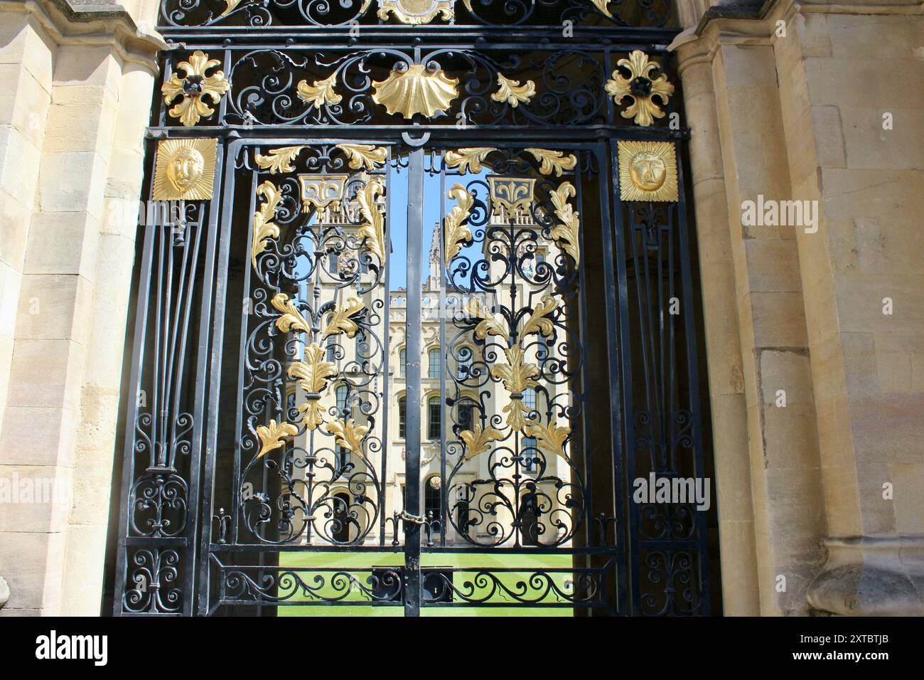 the ornate gold and black iron gate with a glimpse of all souls college ...