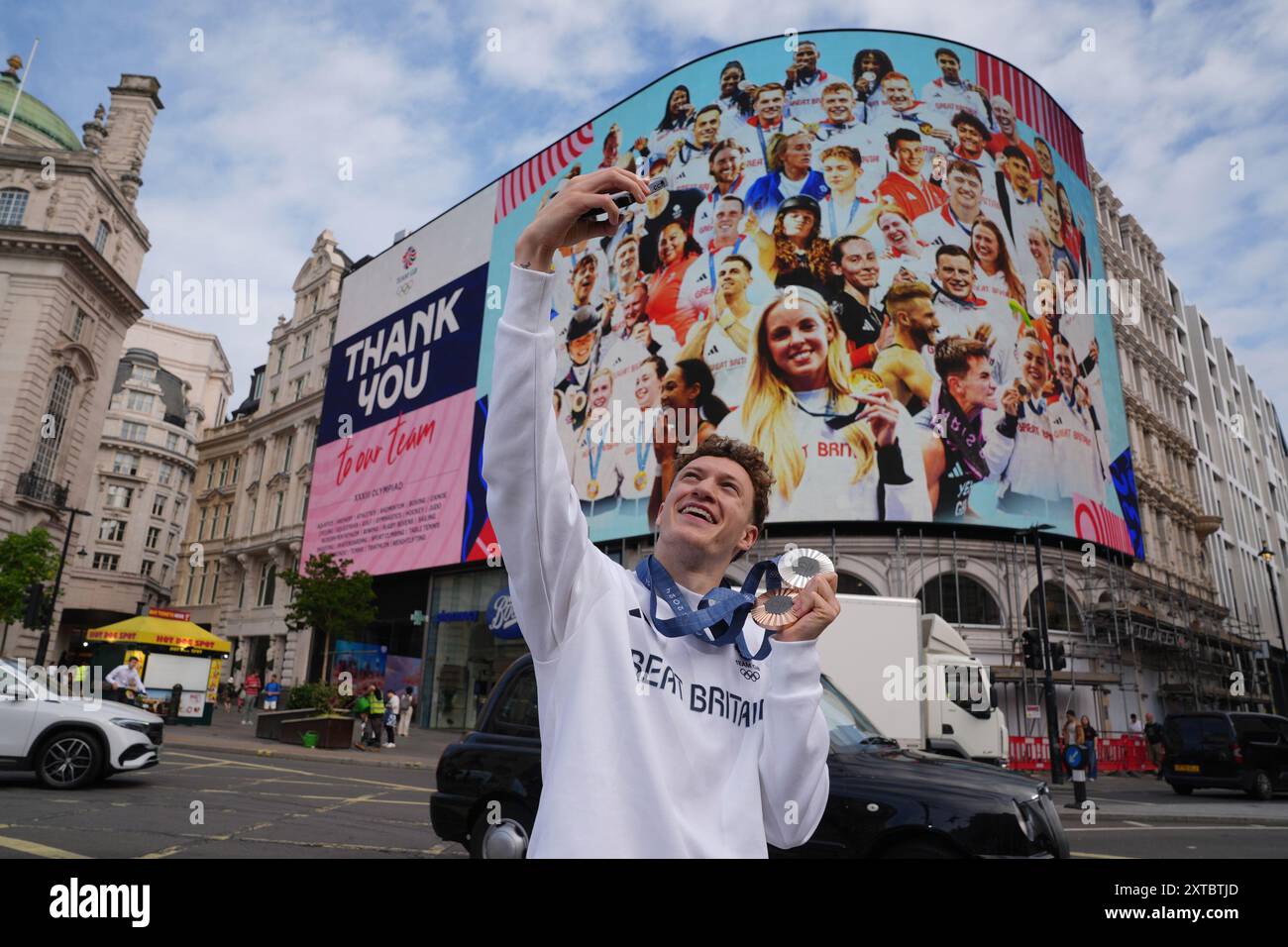 Diver Noah Williams poses with his Olympic medals in front of the ...