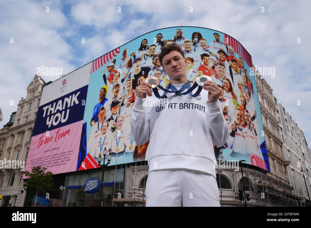 Diver Noah Williams poses with his Olympic medals in front of the ...