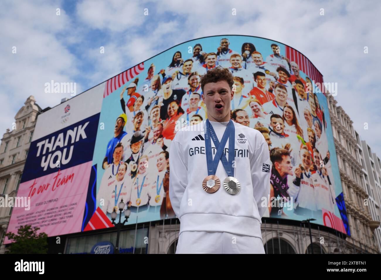 Diver Noah Williams poses with his Olympic medals in front of the ...