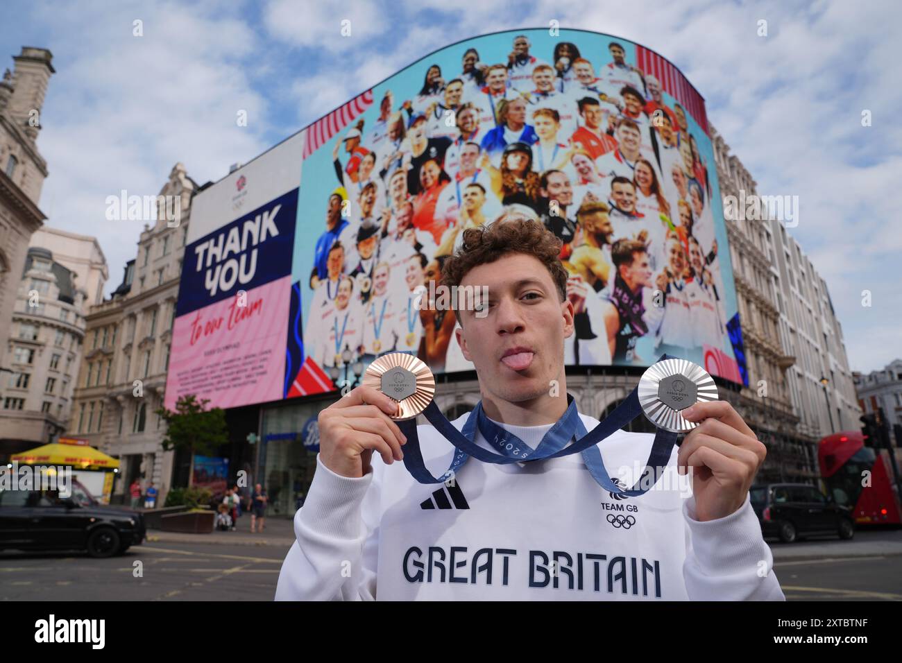Diver Noah Williams poses with his Olympic medals in front of the ...