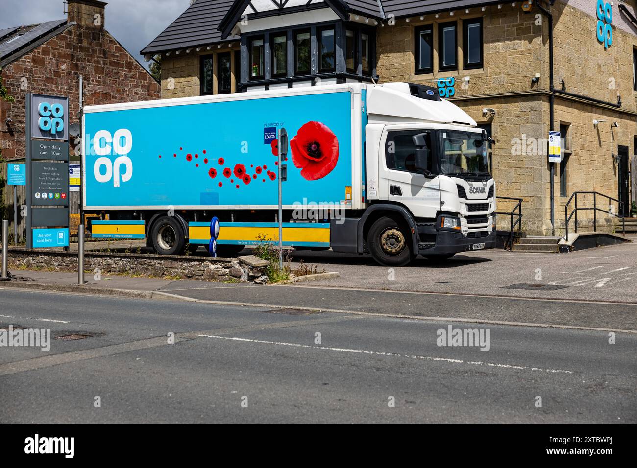 Blue co-op delivery lorry parked outside the co-op village store, a ...