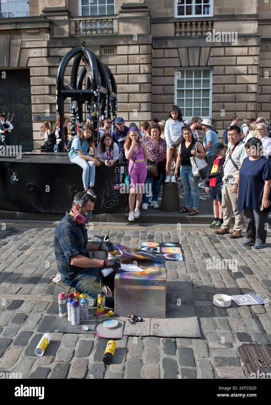 Street spray paint artist on Royal Mile street. Edinburgh, Scotland, UK ...