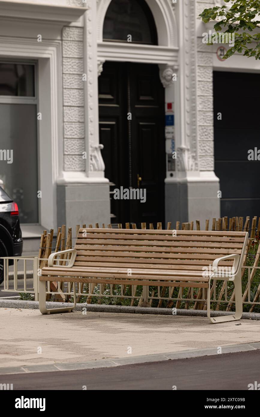 Modern benches in the city square on a sunny day. City improvement ...