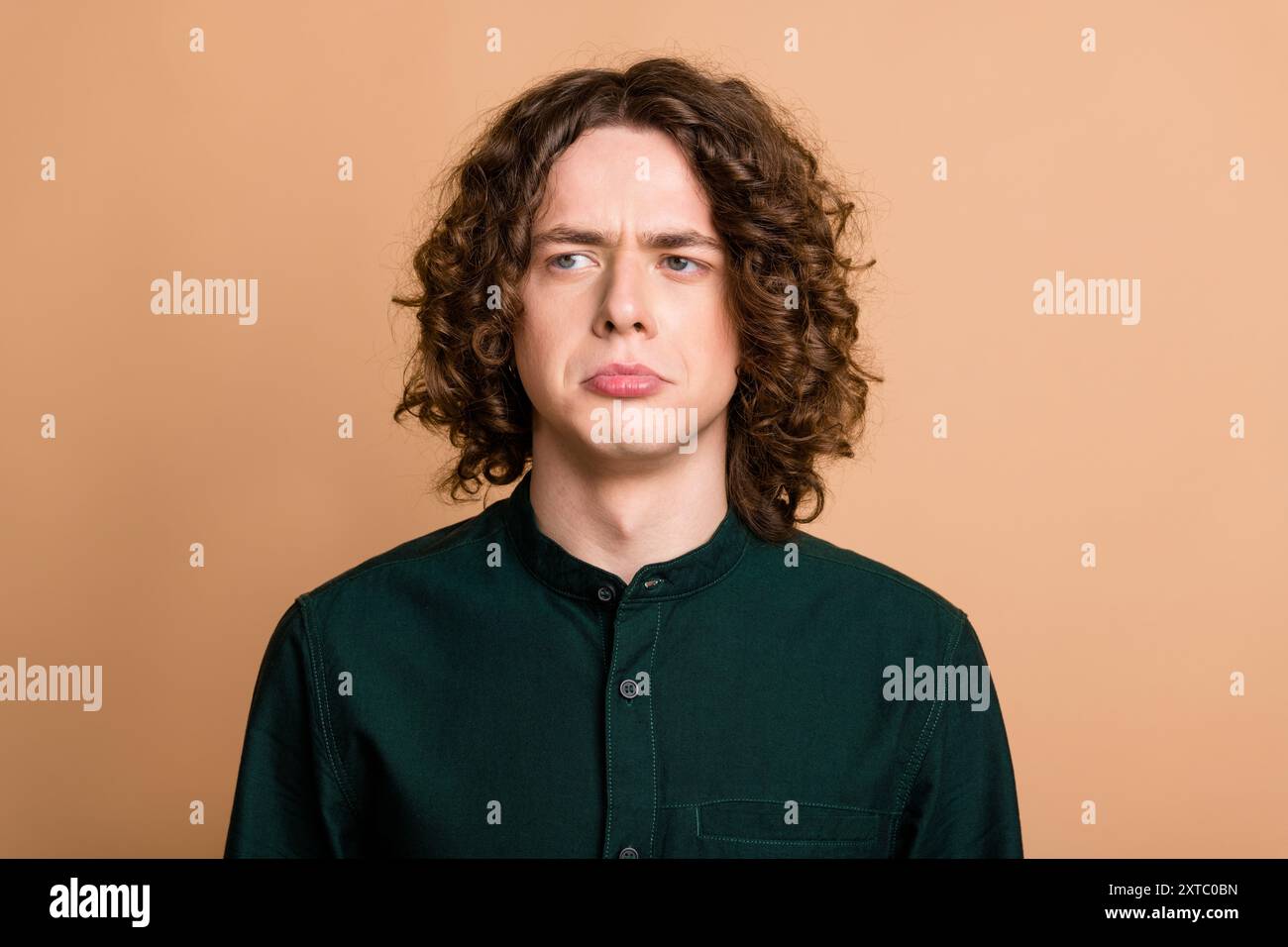 Portrait of sad upset unhappy man wear green stylish clothes look empty ...