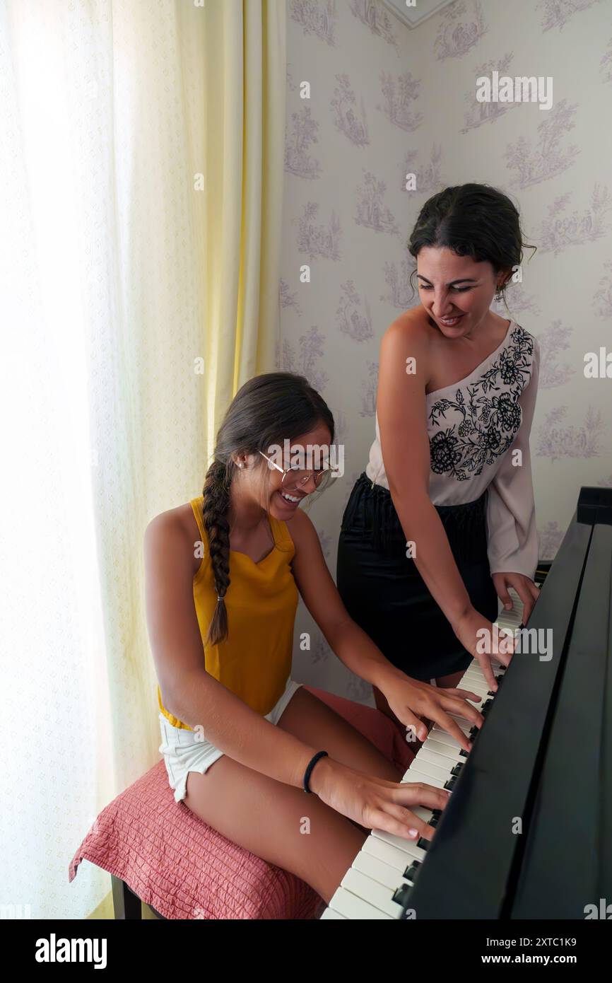 Piano Lesson with Teacher Instructing Student Stock Photo - Alamy