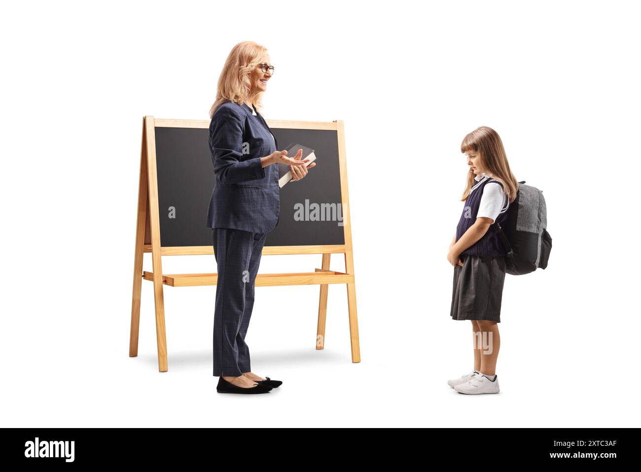 Full length profile shot of a teacher talking to a sad female pupil in ...