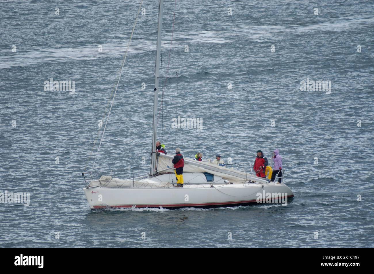 Sailing Yacht coming into harbour Teignmouth Bay Devon England uk Stock ...