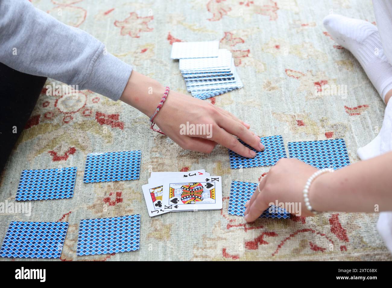 Two girls play card game - playing cards card games competition turn ...