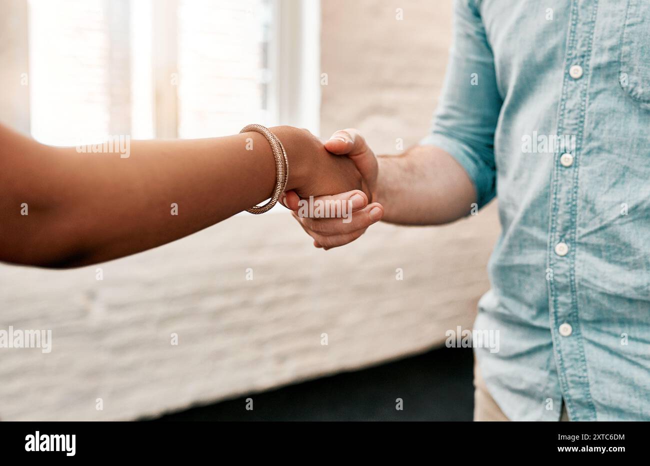 Welcome, meeting and business people shaking hands for introduction ...