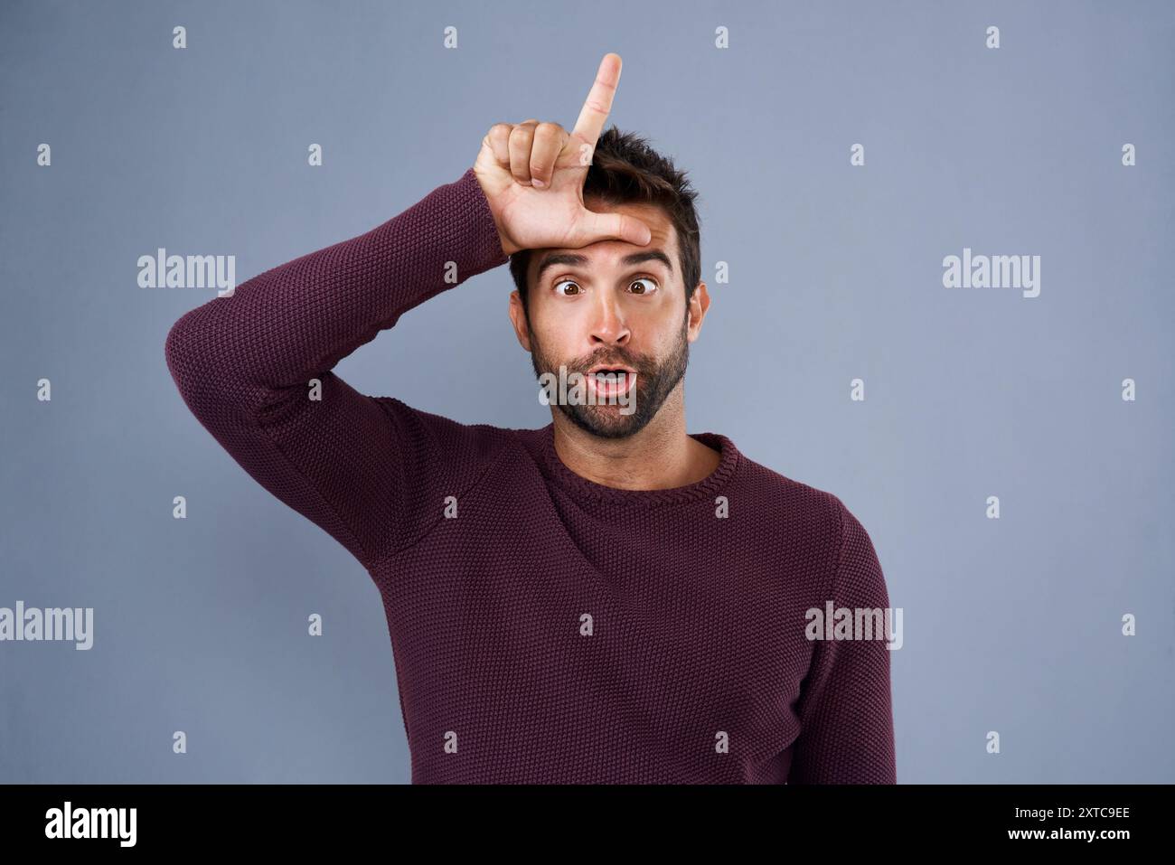 Studio, portrait and man with loser sign for feedback, opinion and ...
