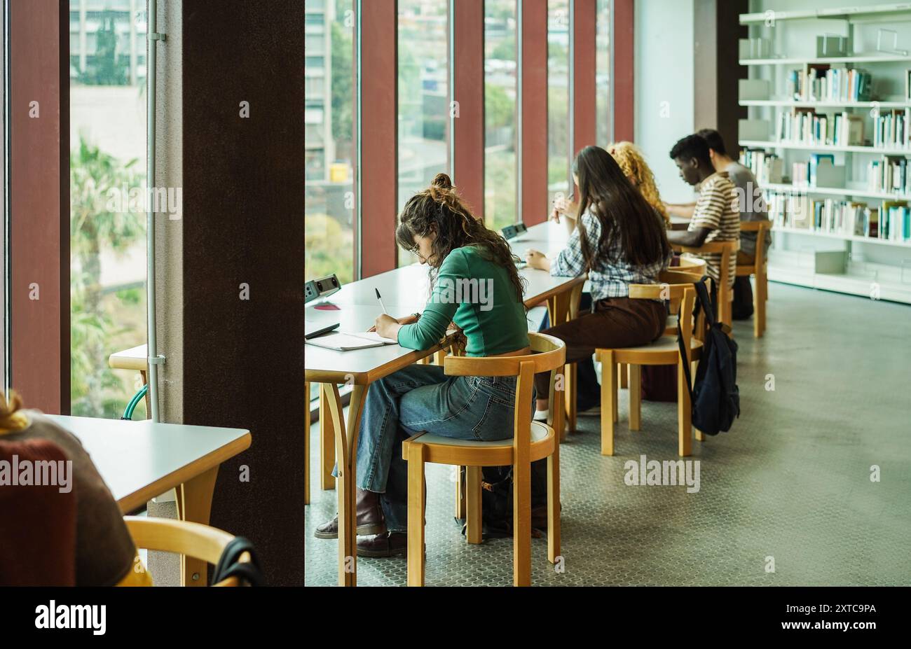 Young group of people studying inside college university library - Back ...