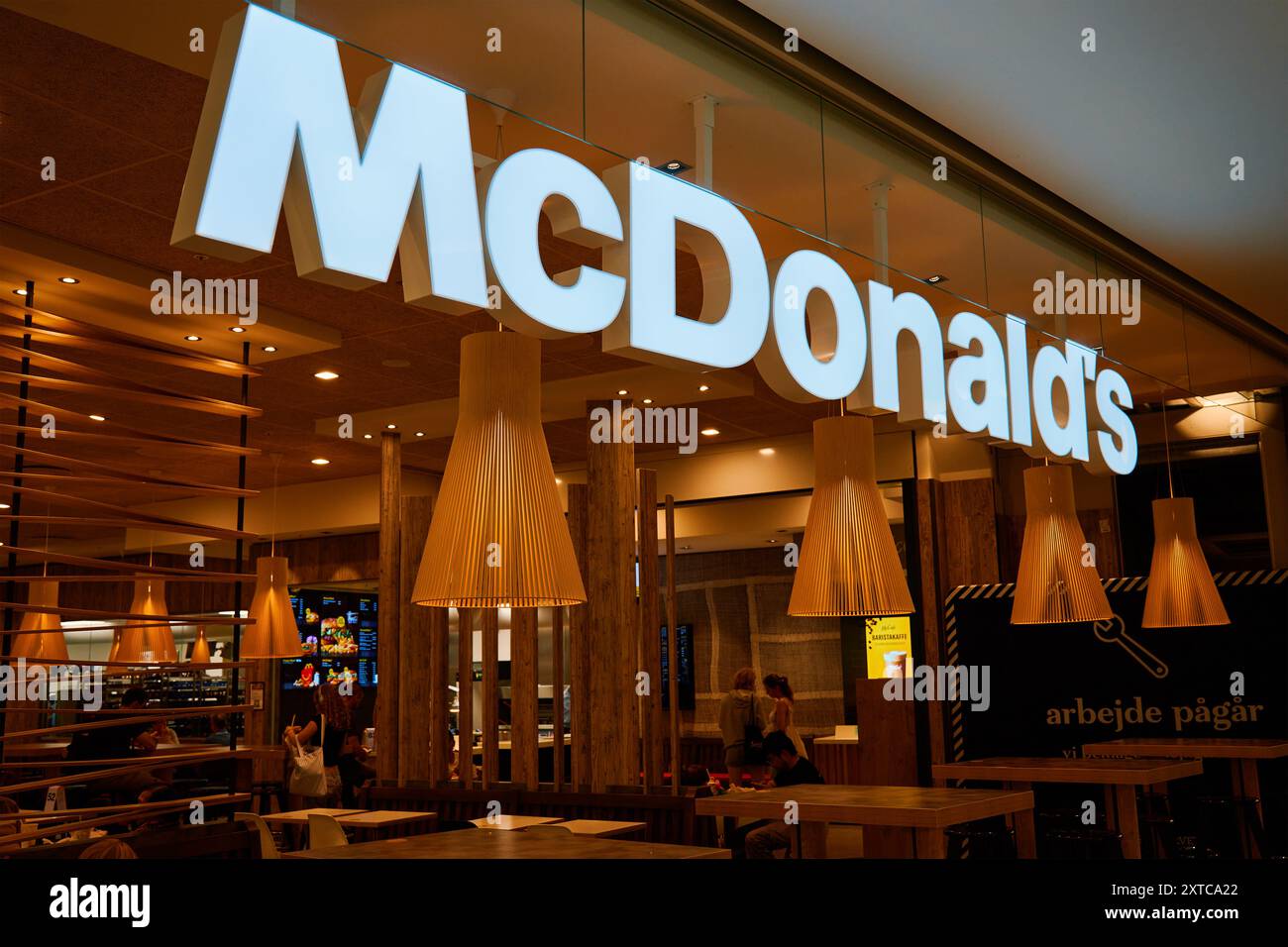 Inside view of McDonald's restaurant with contemporary wooden decor ...