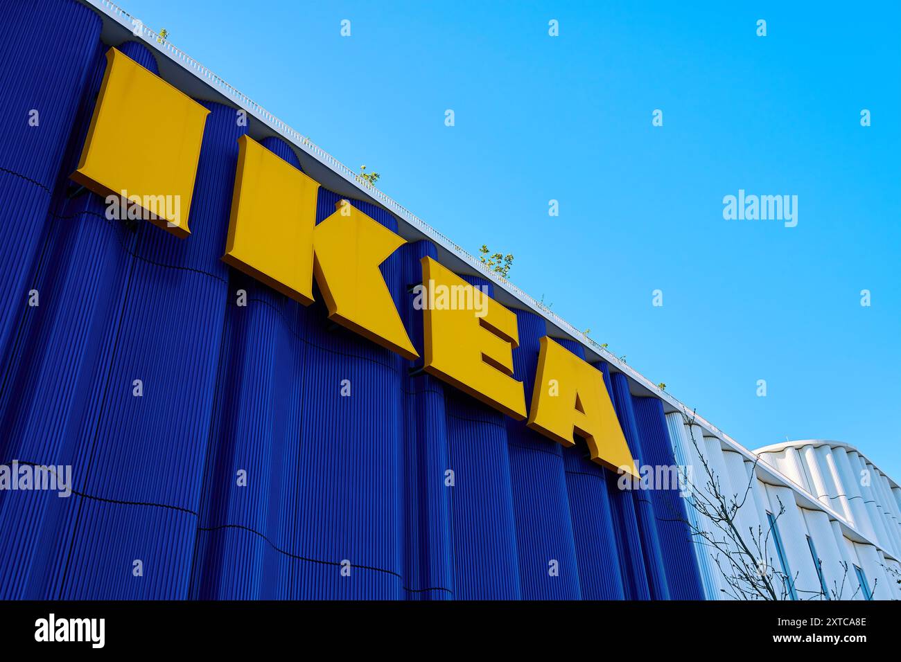 Exterior of IKEA storefront with bold yellow lettering on modern ...