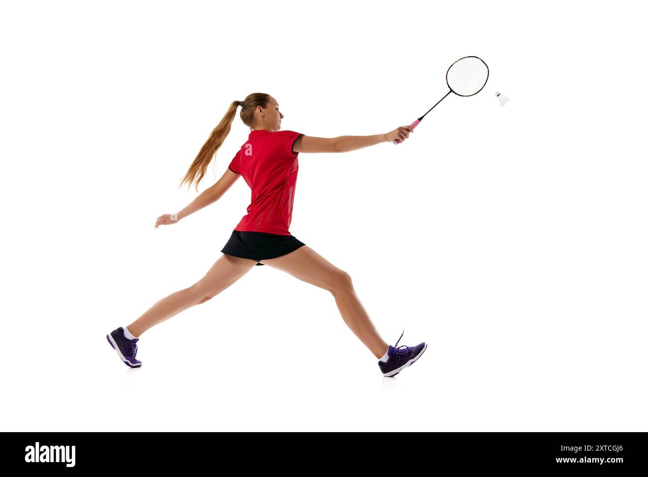Side view photo of young woman in uniform with rocket, badminton player ...