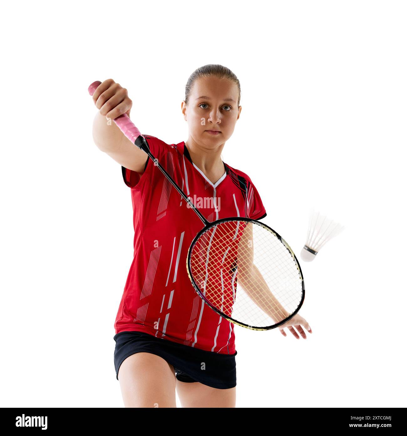 Dynamic portrait of young woman, badminton athlete with focused ...