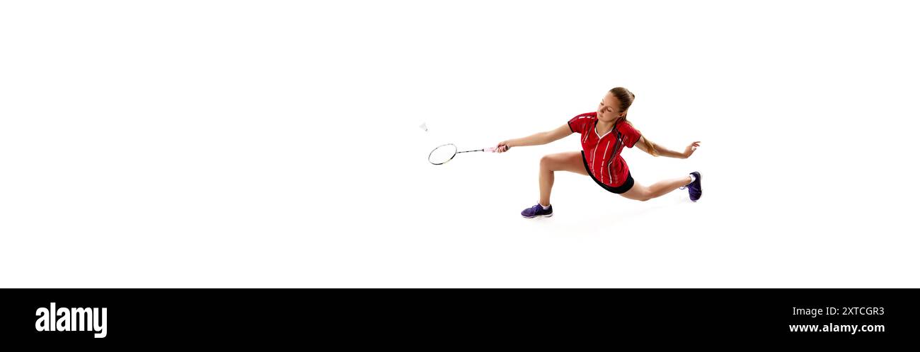 Banner. Young badminton player with racquet, leaping to hit ball during ...