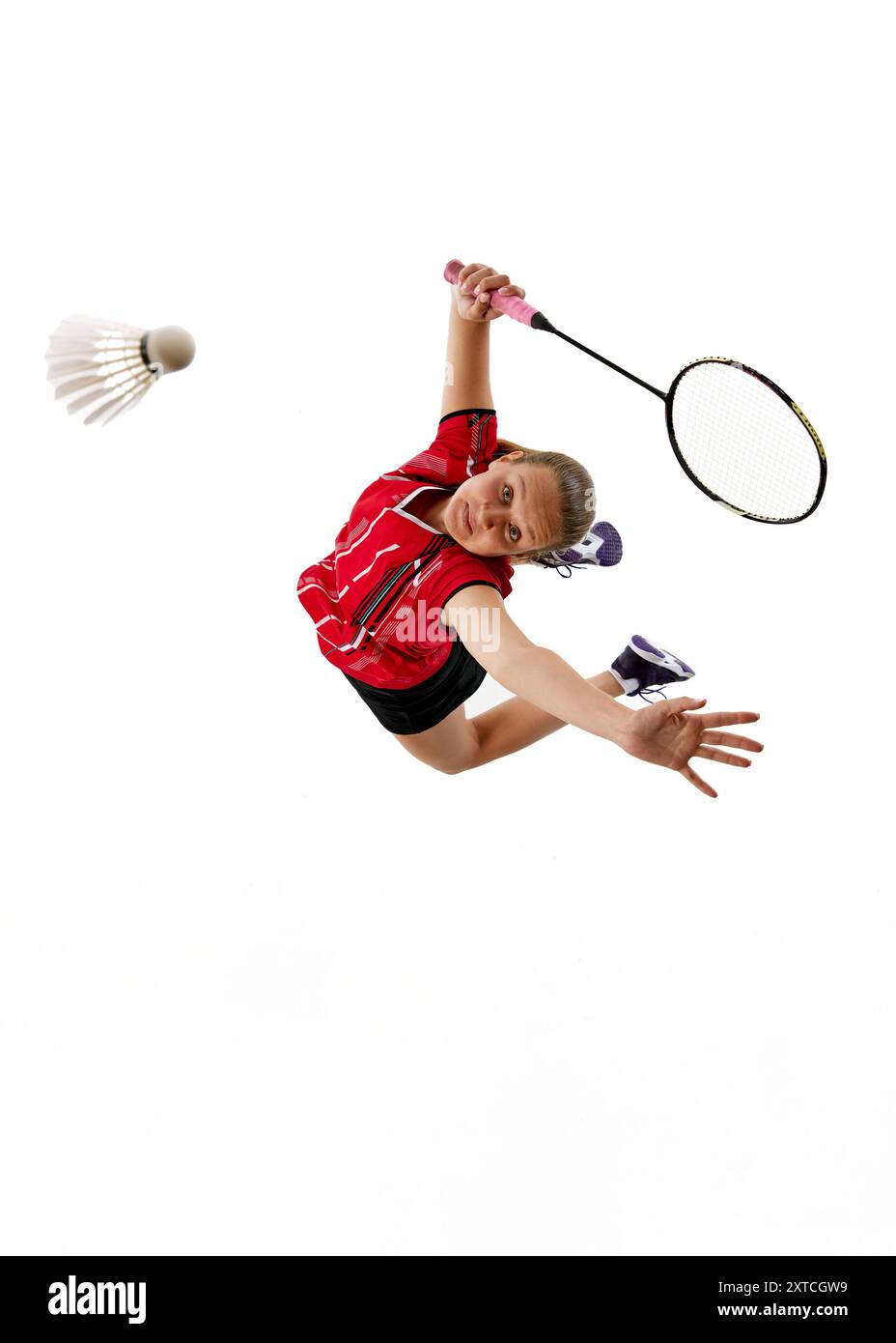 High angle view of young woman, badminton player serving shuttlecock ...