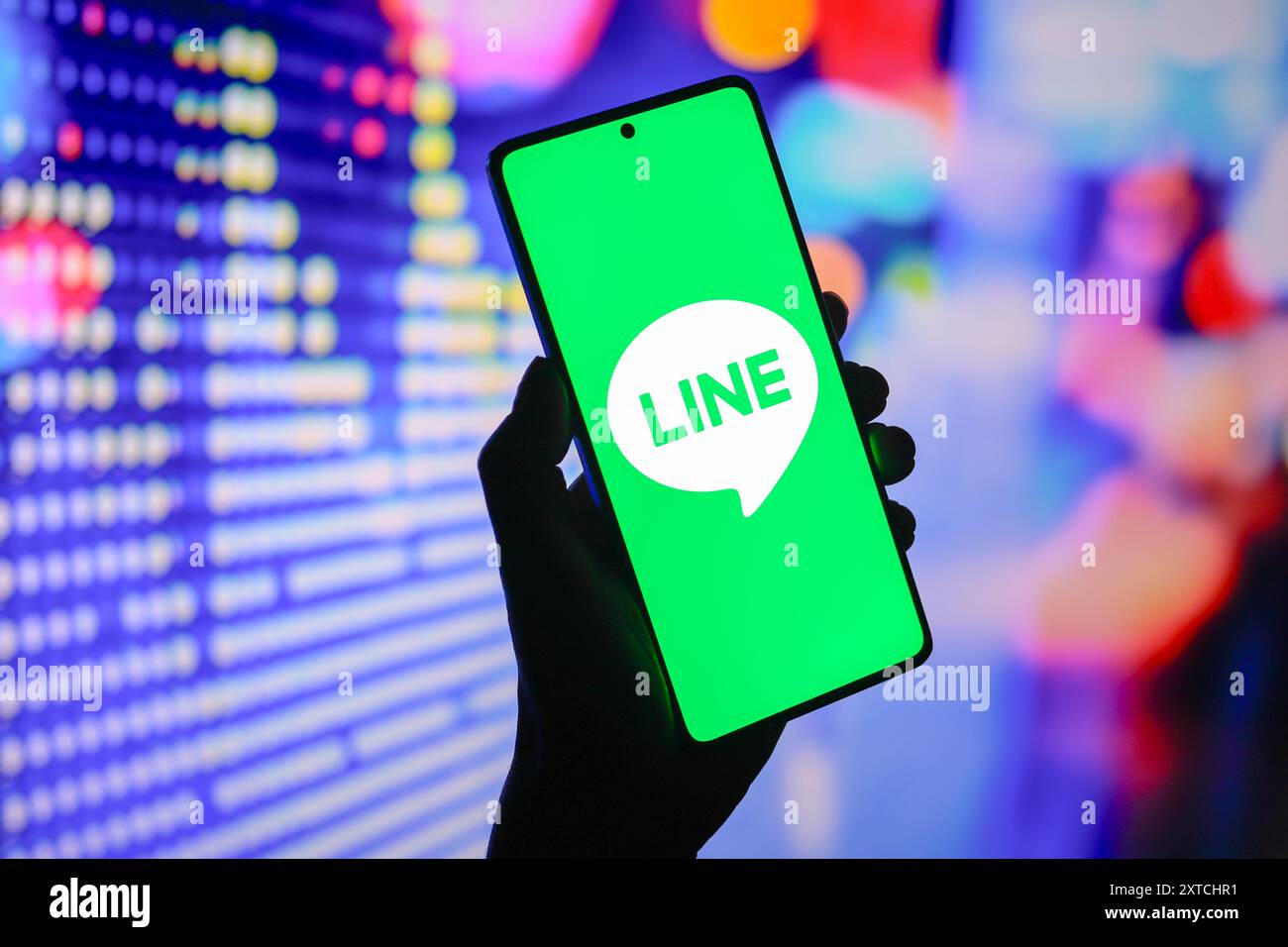 In this photo illustration, the Line Corporation logo is displayed on a ...