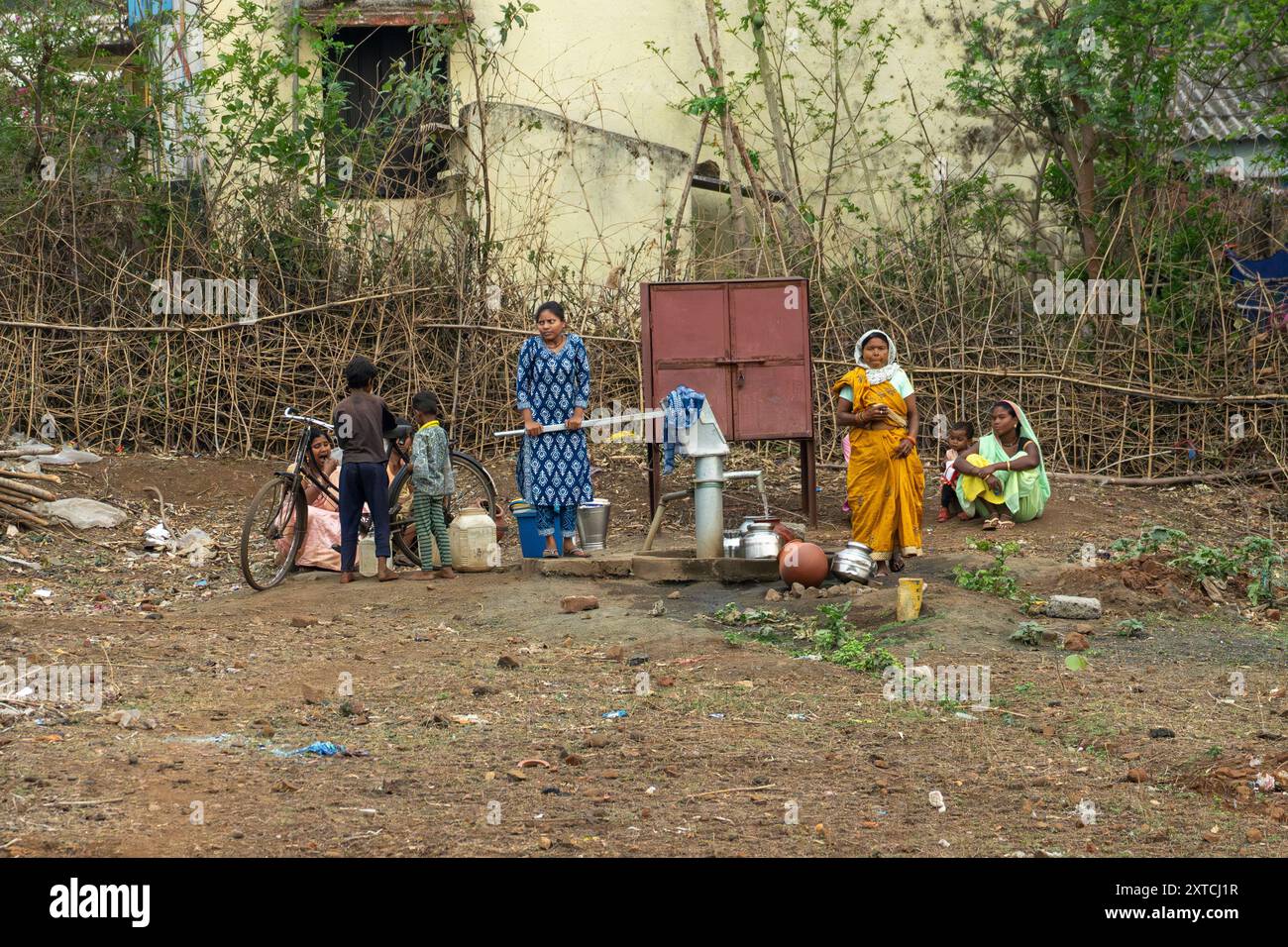 local villagers at the communal water pump Photographed in Madhya ...
