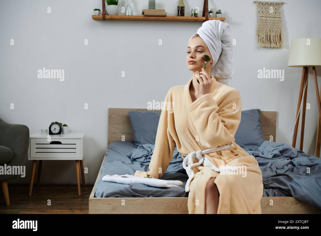 Beautiful young woman pampering herself hi-res stock photography and ...