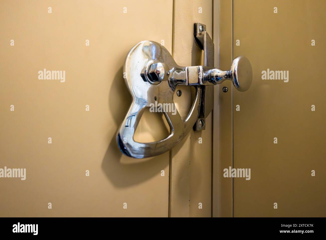 Close-up of the locking mechanism of the train toilet in the Alpine ...