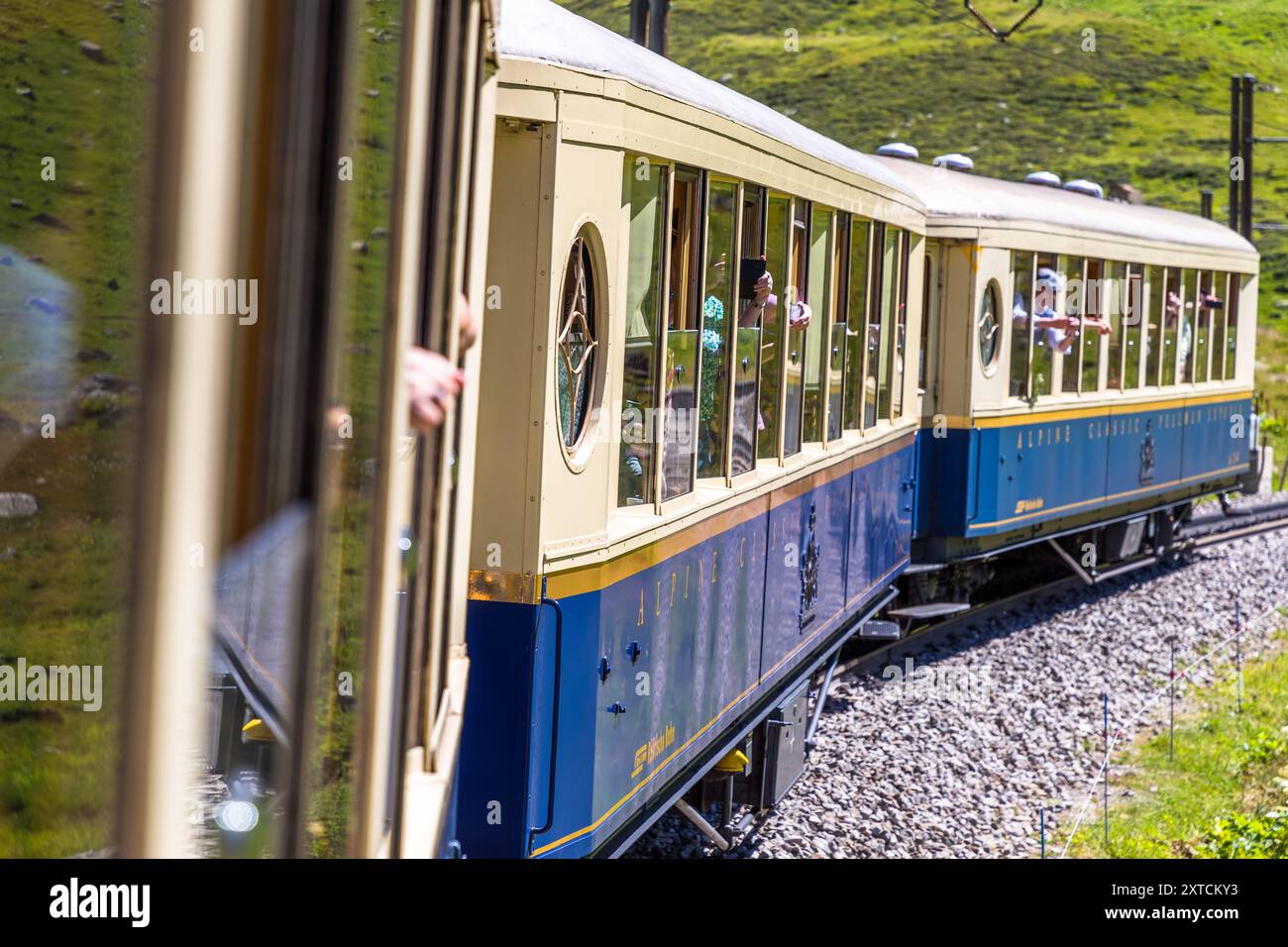Train passengers on the Alpine Classic Pullman Express at the Oberalp ...