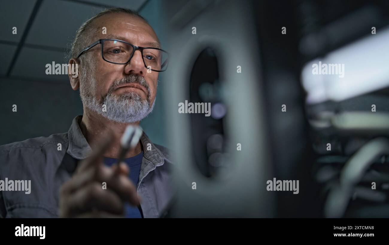 Technician works in computer server hi-res stock photography and images ...