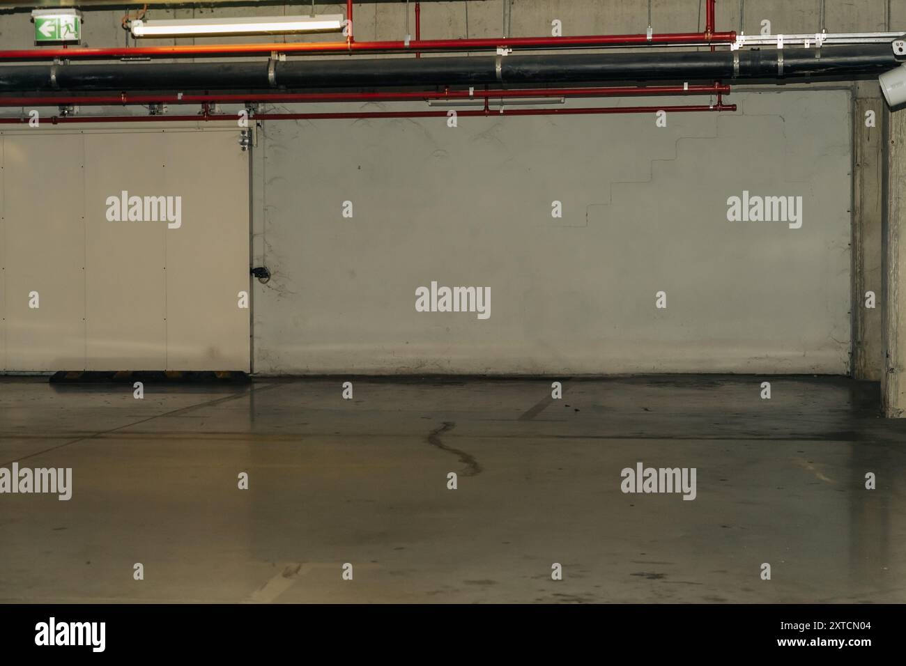 Parking lot with overhead dim light, underground parking garage Stock ...