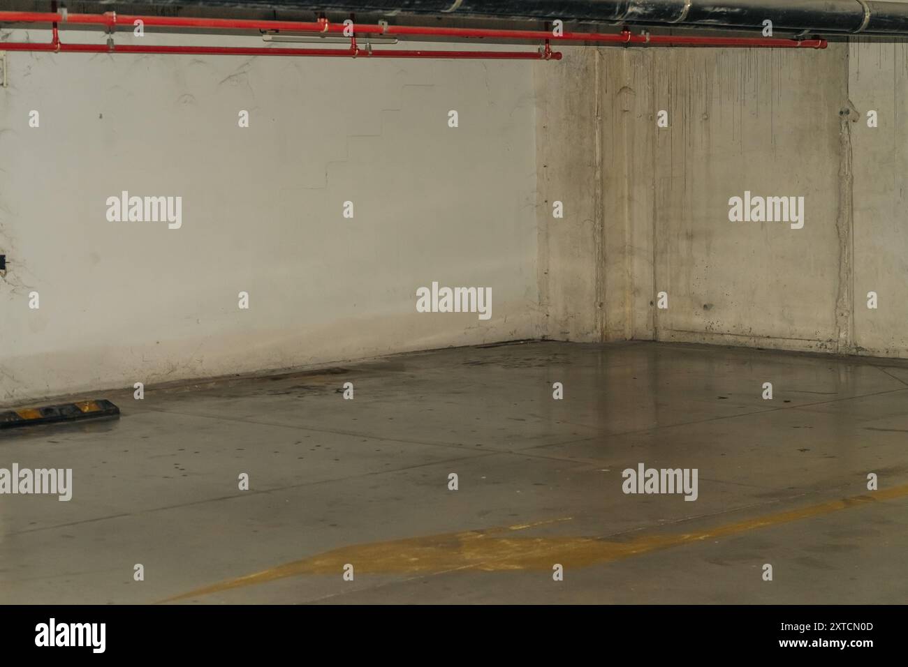 Parking lot with overhead dim light, underground parking garage Stock ...
