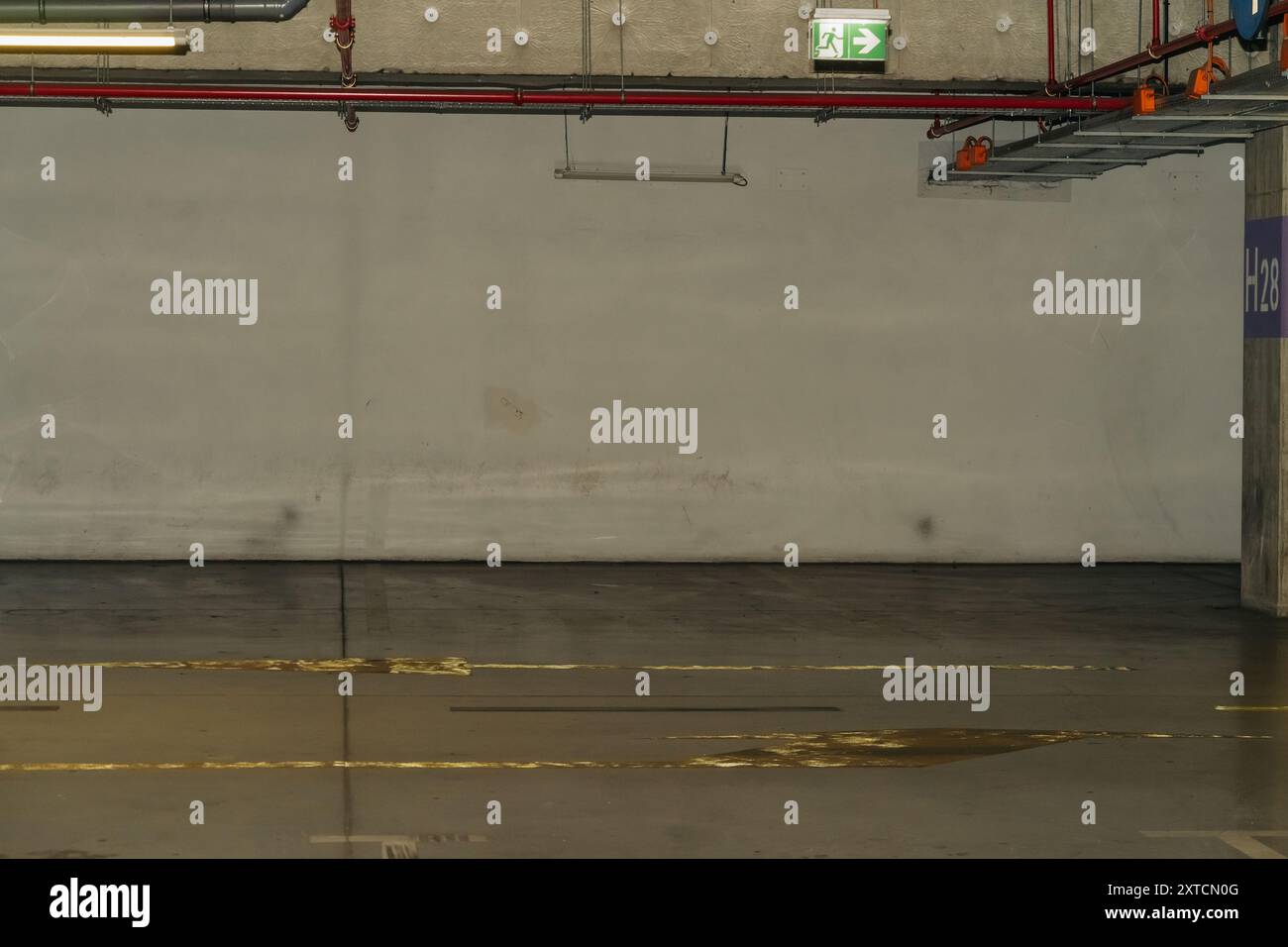 Parking lot with overhead dim light, underground parking garage Stock ...
