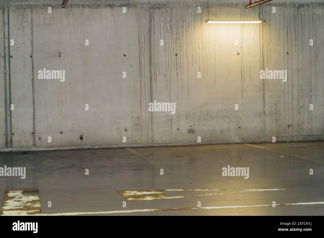 Parking lot with overhead dim light, underground parking garage Stock ...