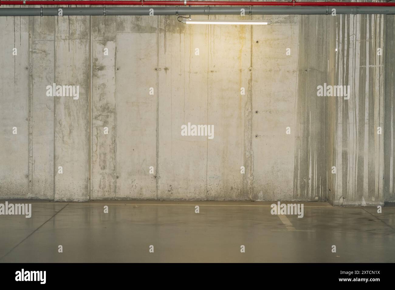 Parking lot with overhead dim light, underground parking garage Stock ...