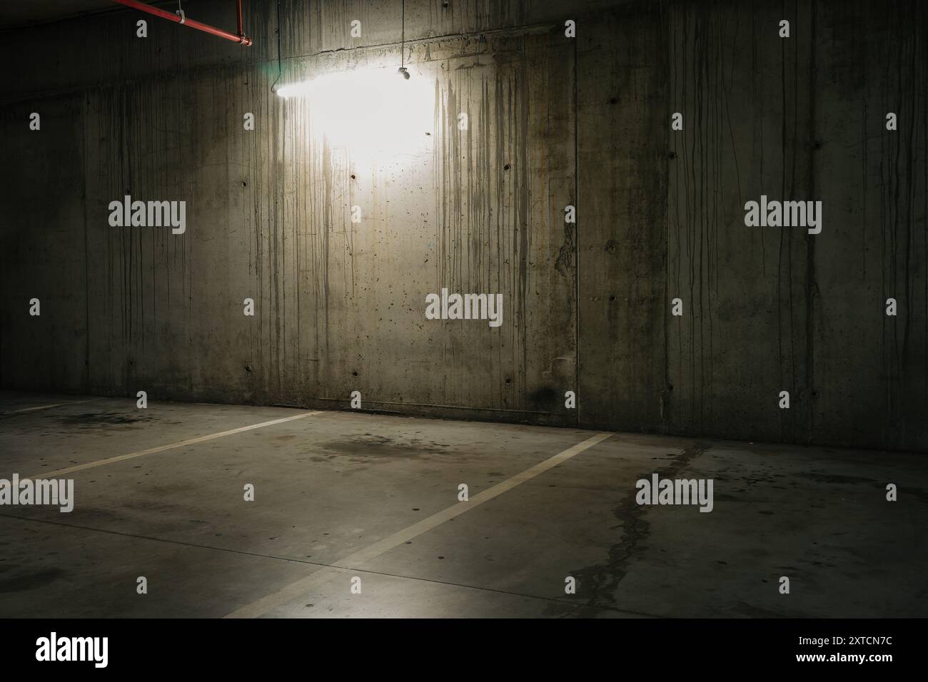 Parking lot with overhead dim light, underground parking garage Stock ...