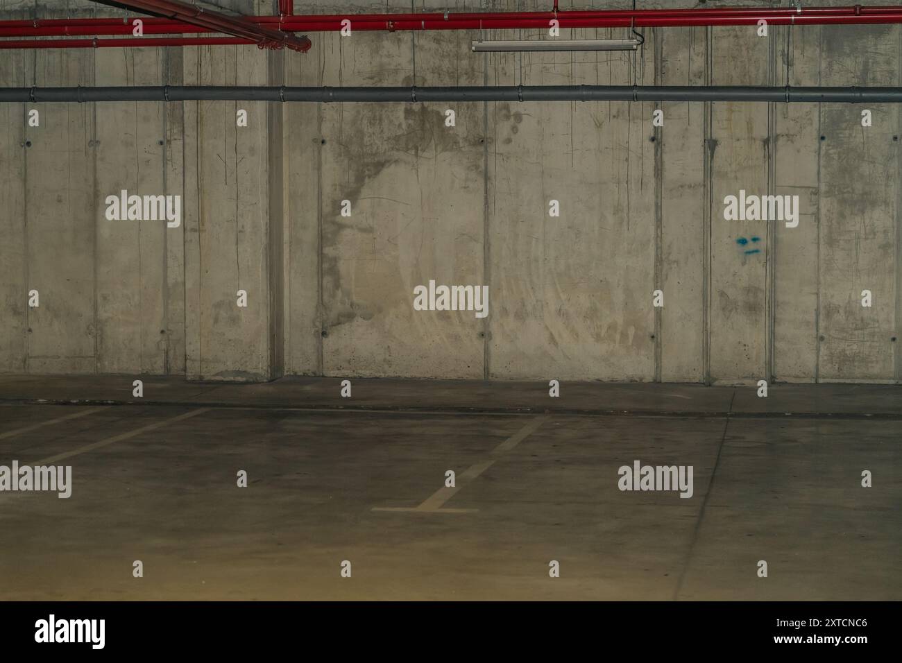 Parking lot with overhead dim light, underground parking garage Stock ...