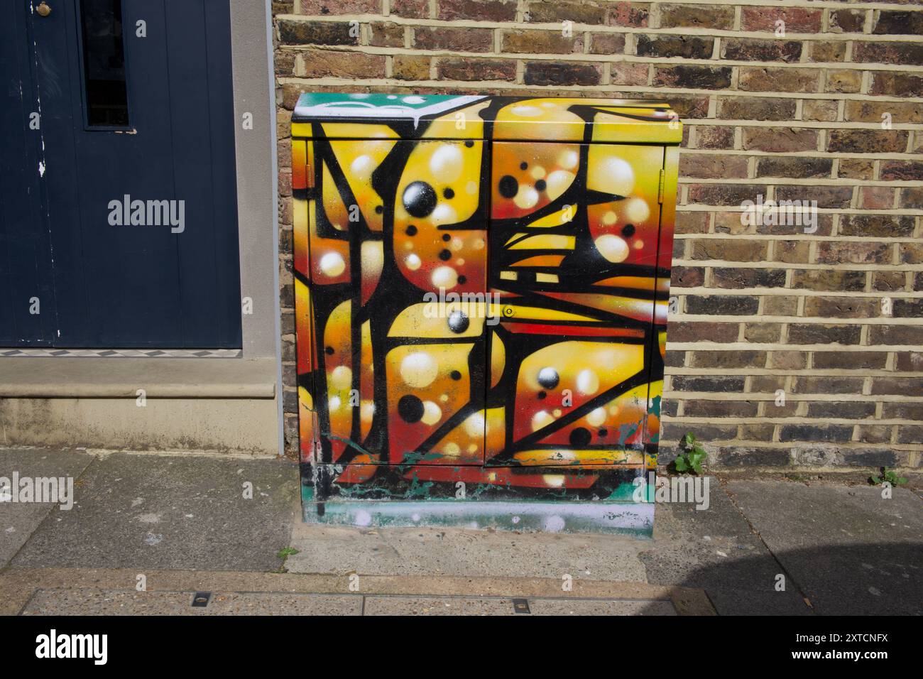 Brightly painted telecommunications box in Chiswick, London W4 Stock ...