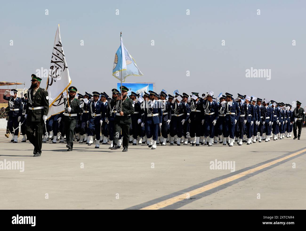 Taliban security personnel march during a military parade to mark the ...
