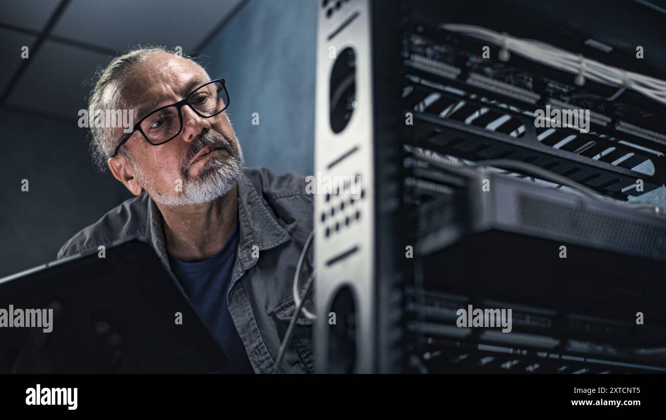 Technician works in computer server hi-res stock photography and images ...