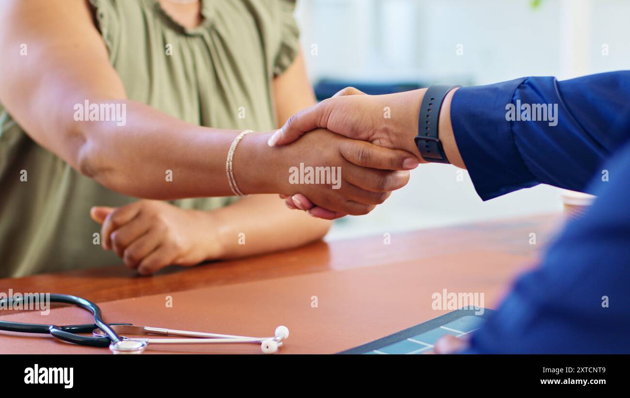 Healthcare Professional and Patient Shaking Hands in a Medical Office ...