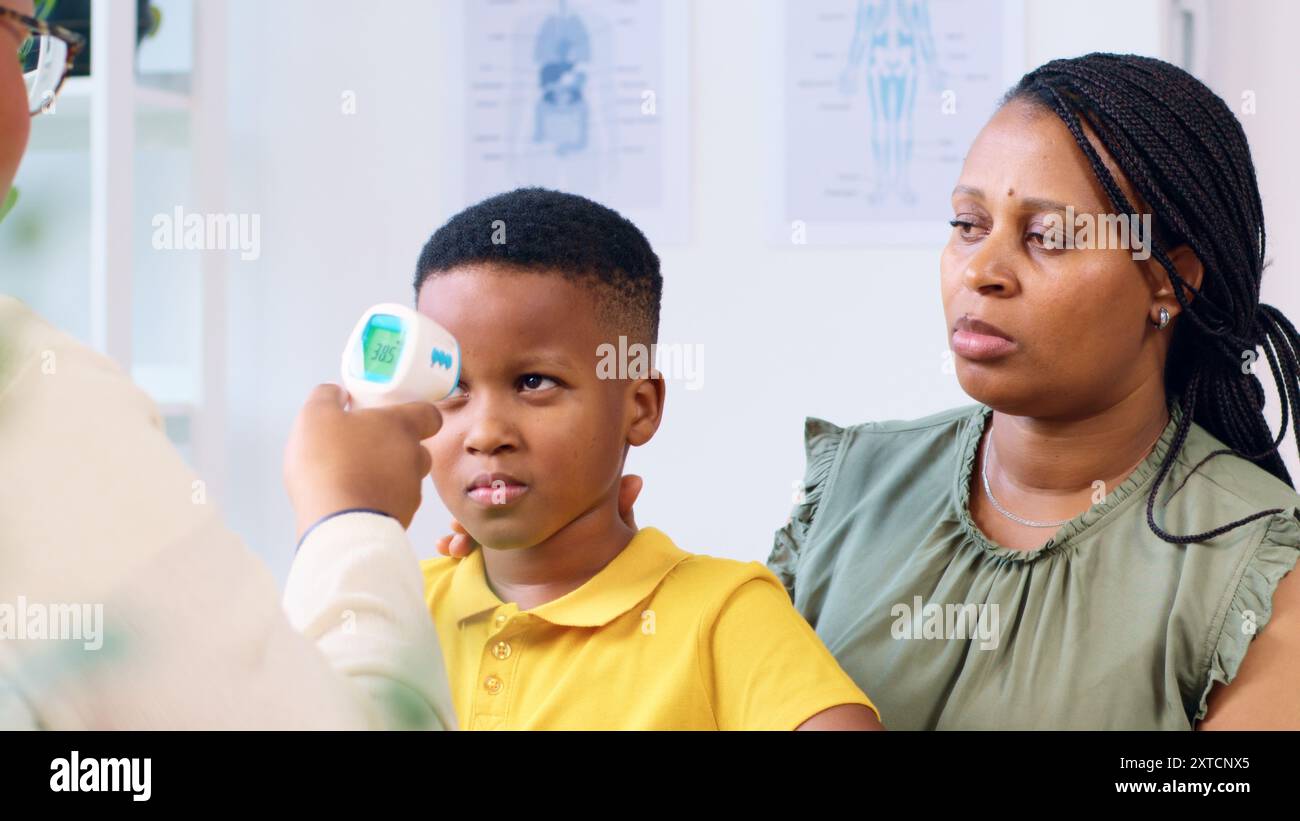 Doctor taking temperature office hi-res stock photography and images ...